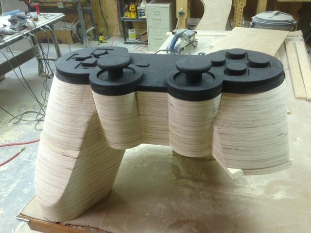 This giant custom PlayStation controller table is ridiculously detailed