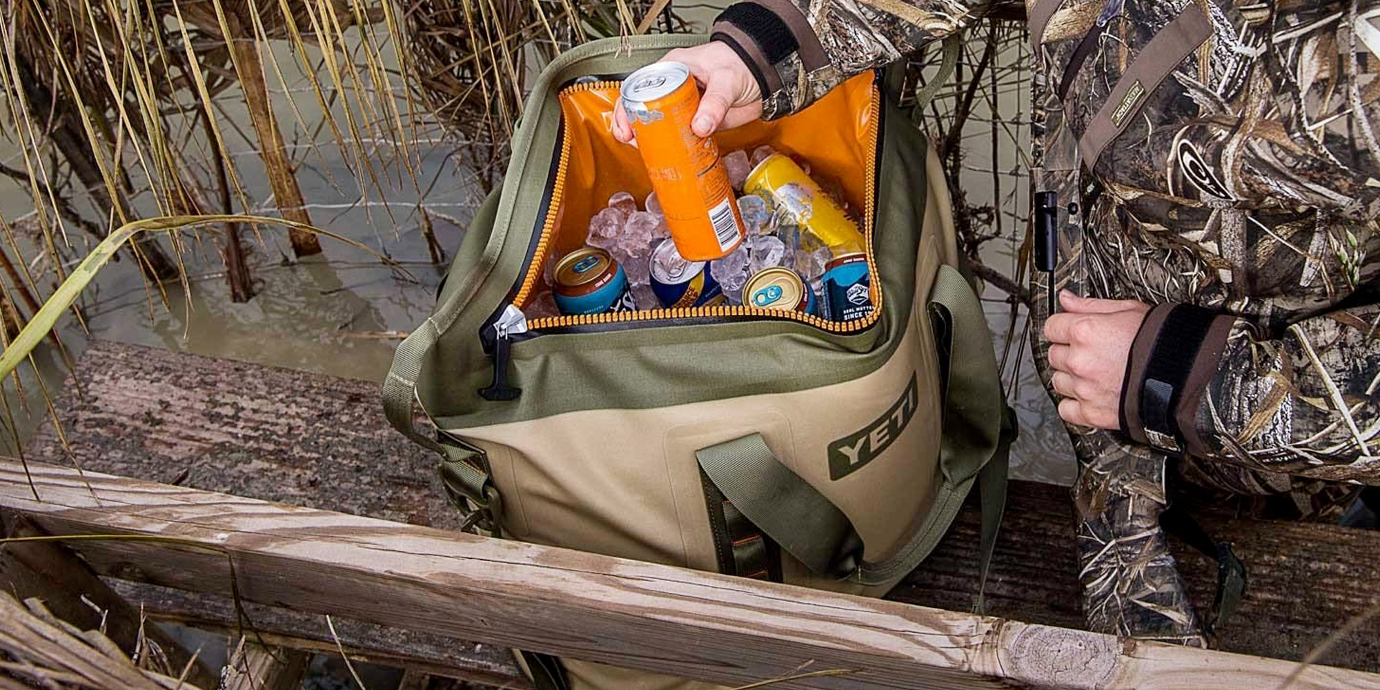 Carry 40 lbs. of ice or 36 cans in the YETI Hopper Two Portable Cooler ...