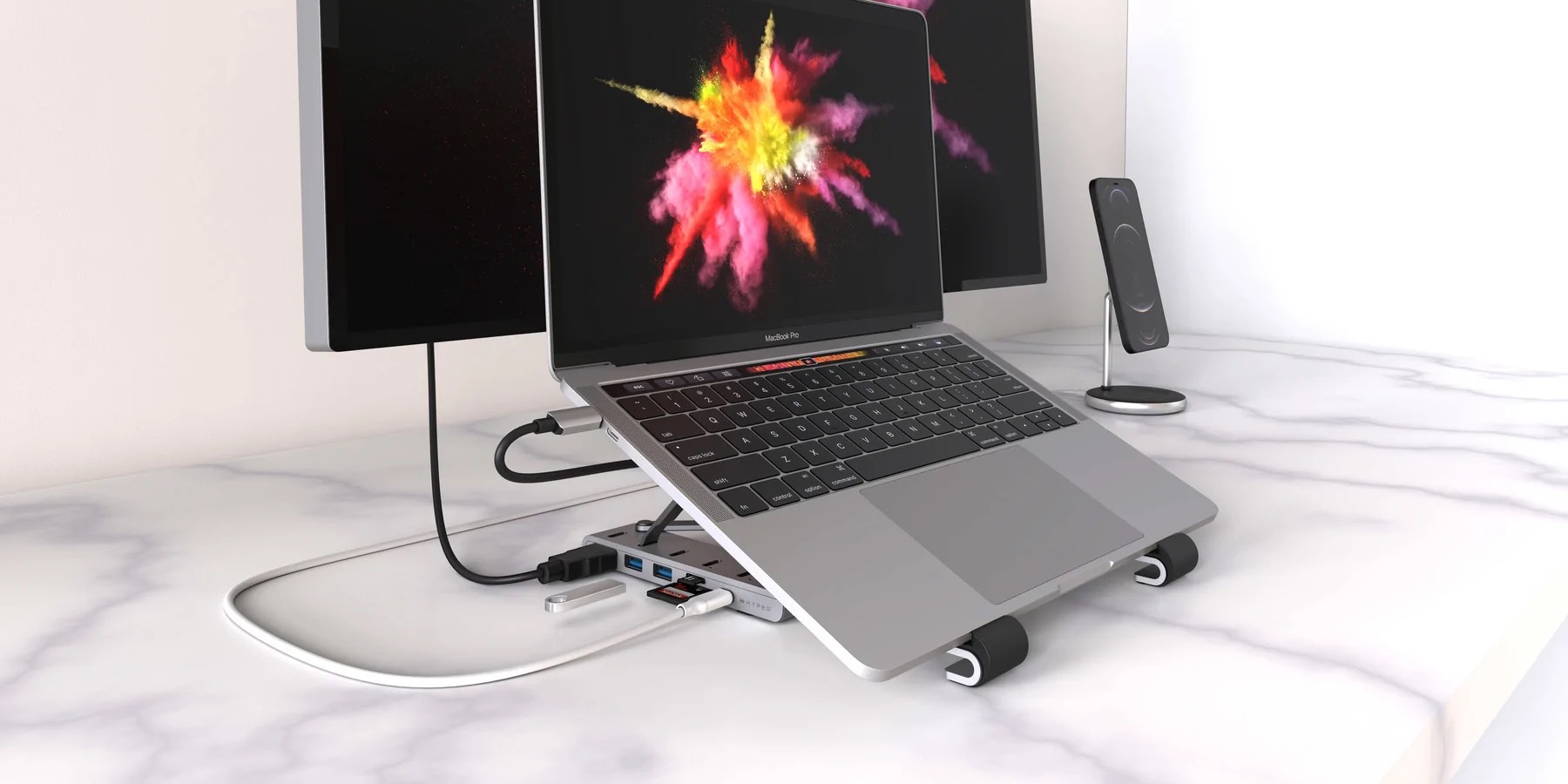 HYPER's metal MacBook stand with integrated 7-in-1 USB-C and 4K HDMI ...